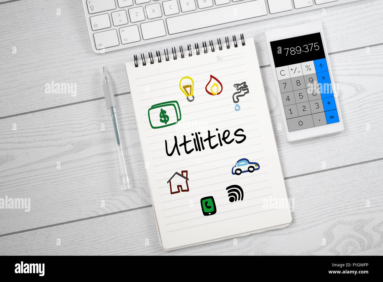 white desktop with notebook and smartphone showing utilities. All ...