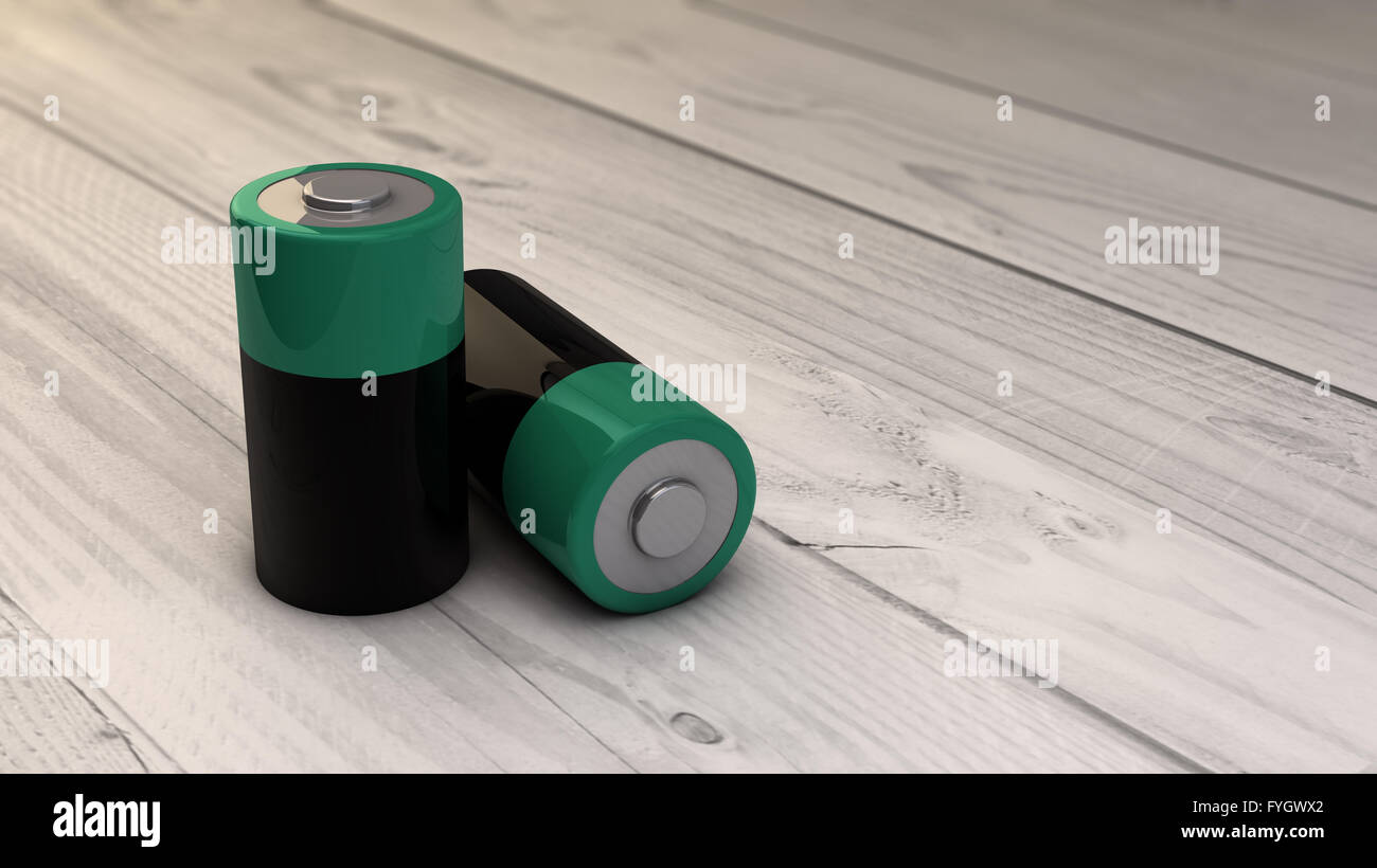 render of two batteries over wooden floor Stock Photo - Alamy
