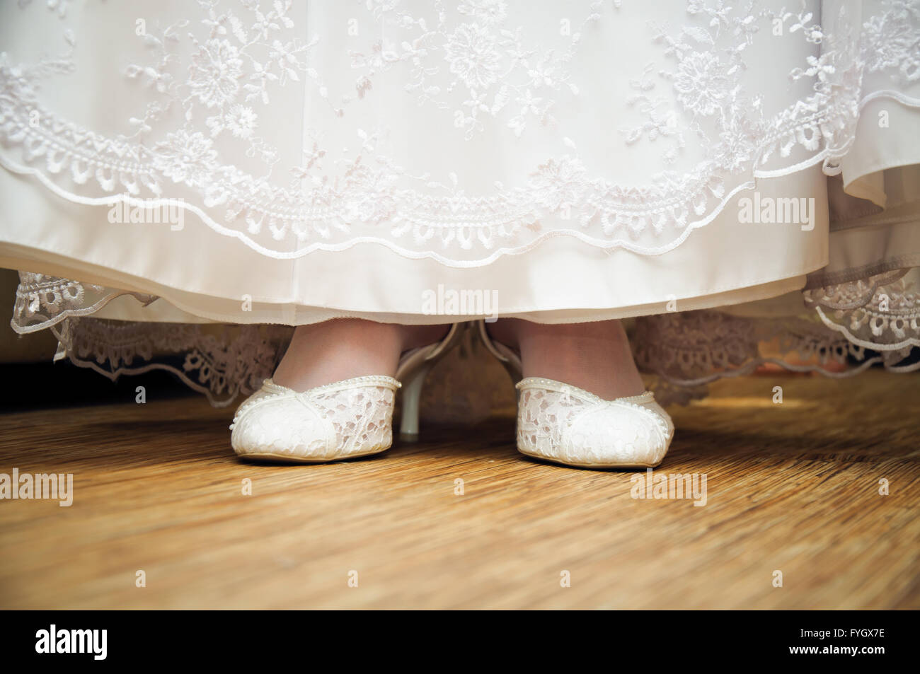 wedding dress and shoe on a bride Stock Photo - Alamy