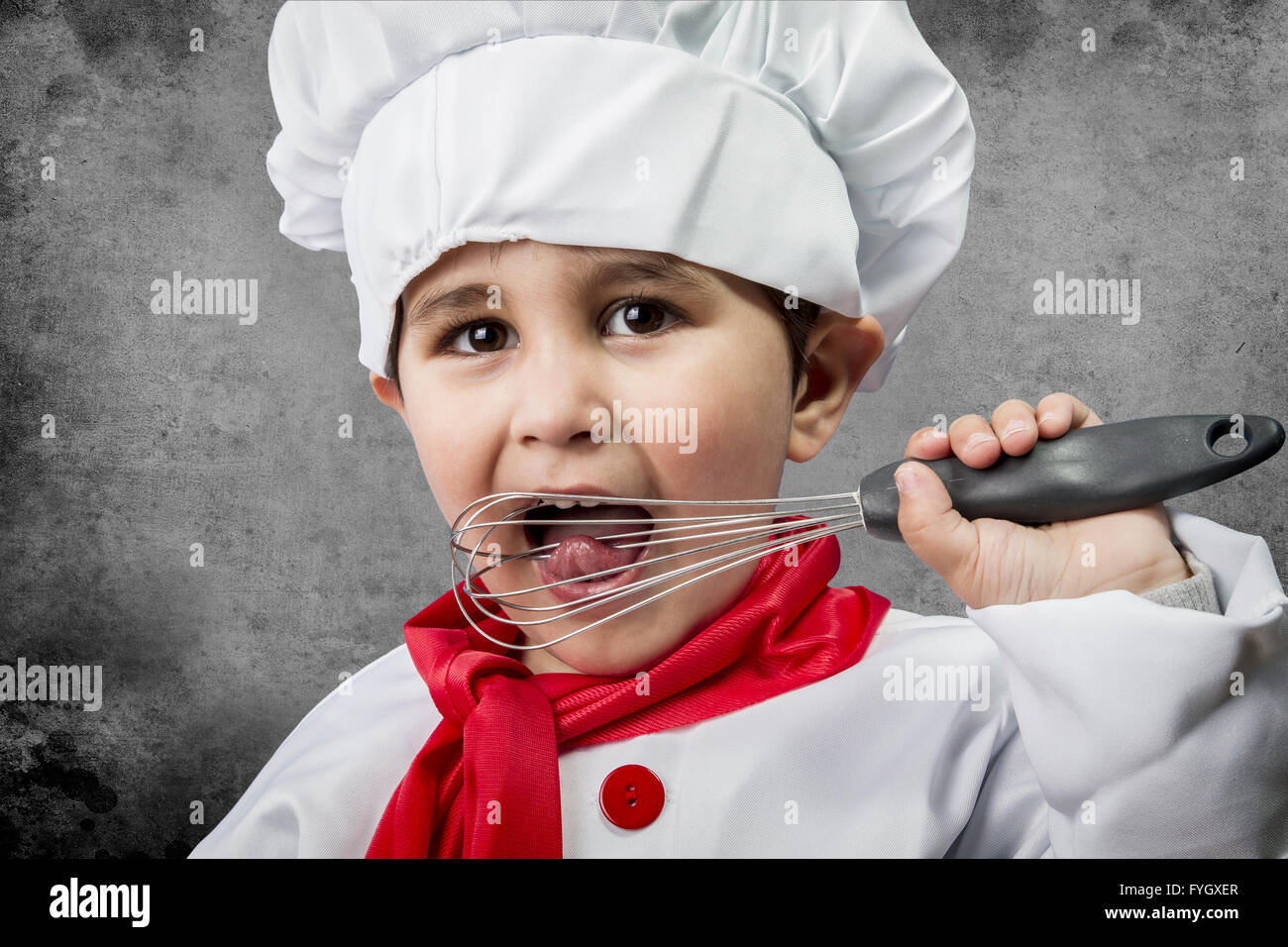 A little boy cook in uniform over vintage background Stock Photo - Alamy