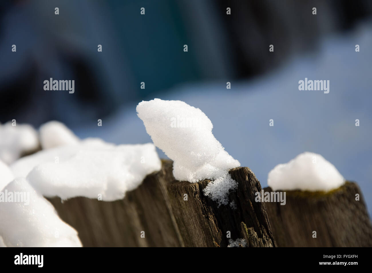 white snow of a fence. big snowfall Stock Photo - Alamy