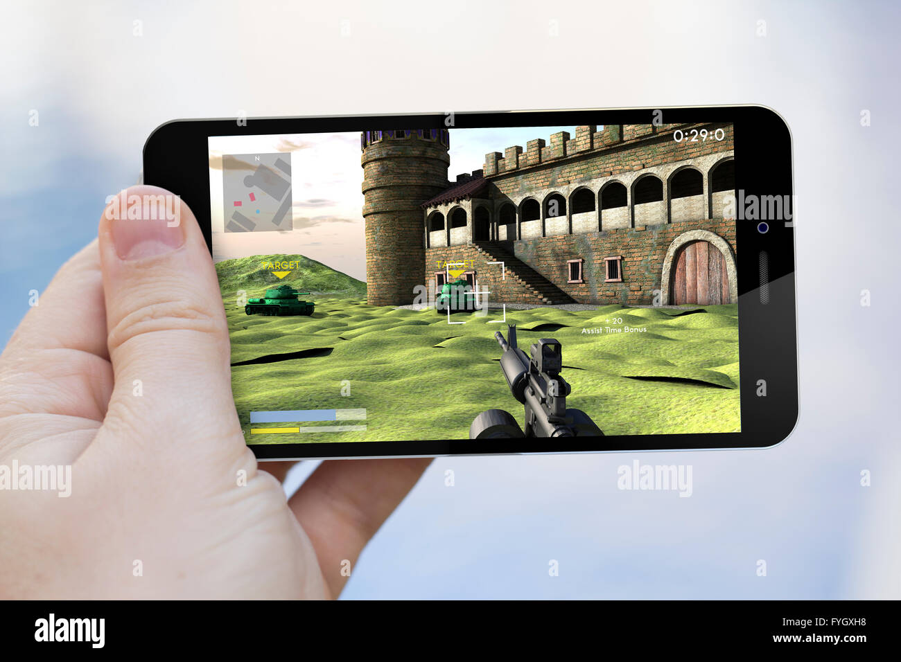 gaming concept: hand holding a 3d generated smartphone with videogame ...