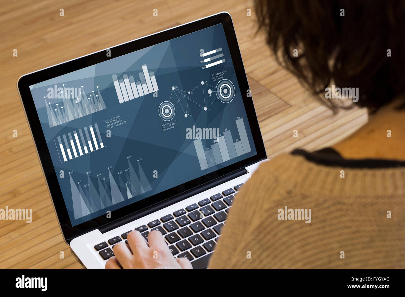 business concept: woman analyzing statistics on a laptop screen. Screen ...