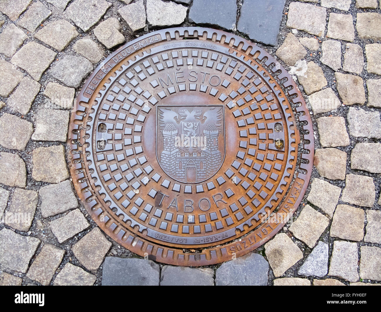 Hatch of sewage on the paving road Stock Photo - Alamy