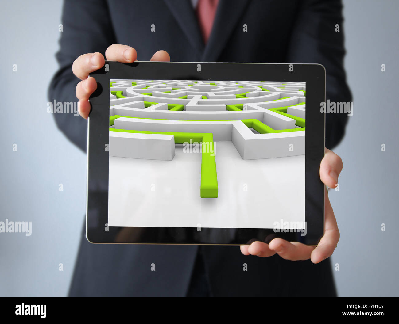 businessman with labyrinth tablet Stock Photo - Alamy