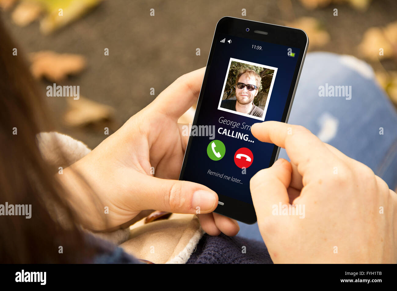 communication concept: young woman receiving phone call at the park ...