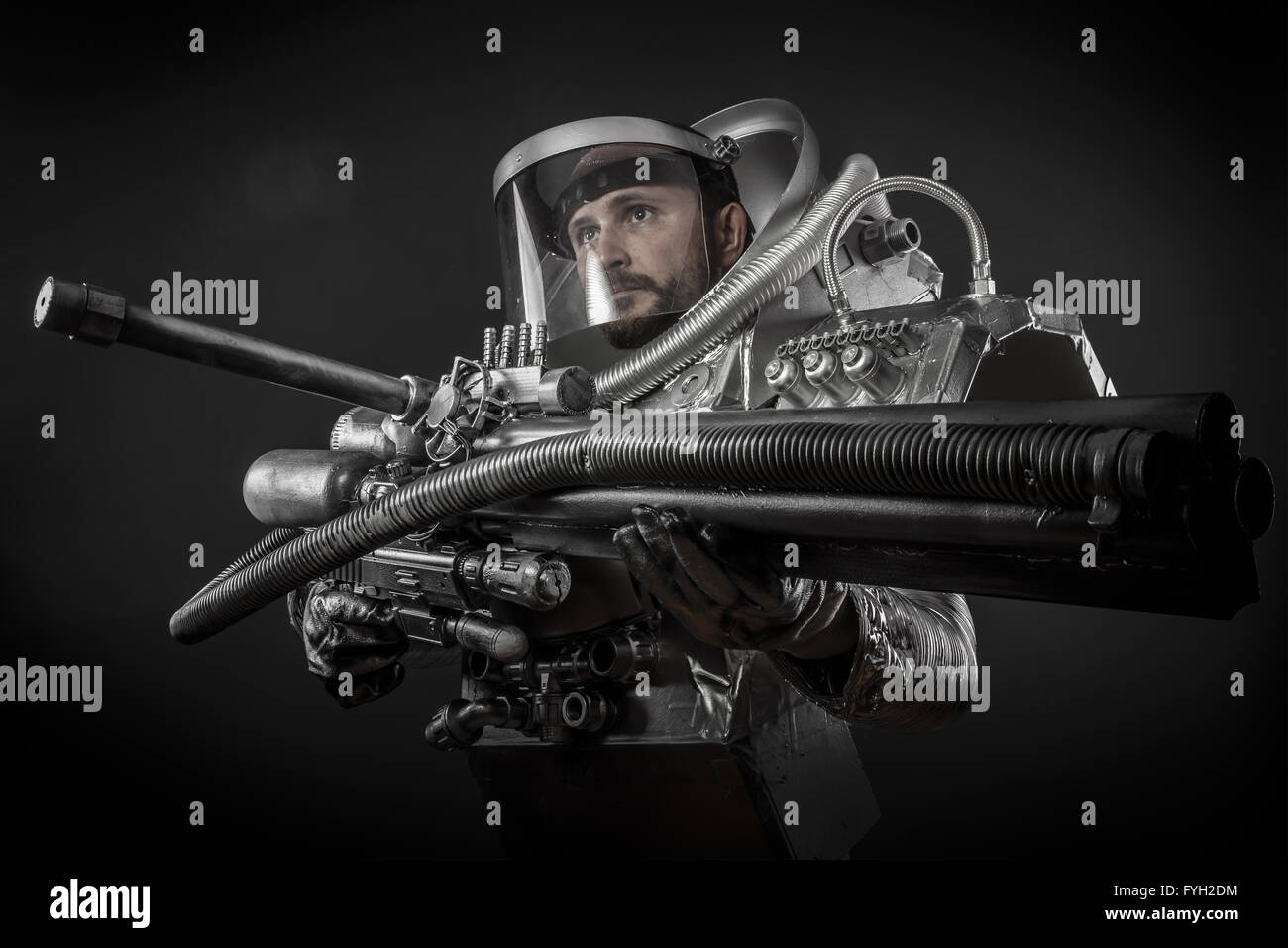 Astronaut, fantasy warrior with huge space weapon Stock Photo - Alamy