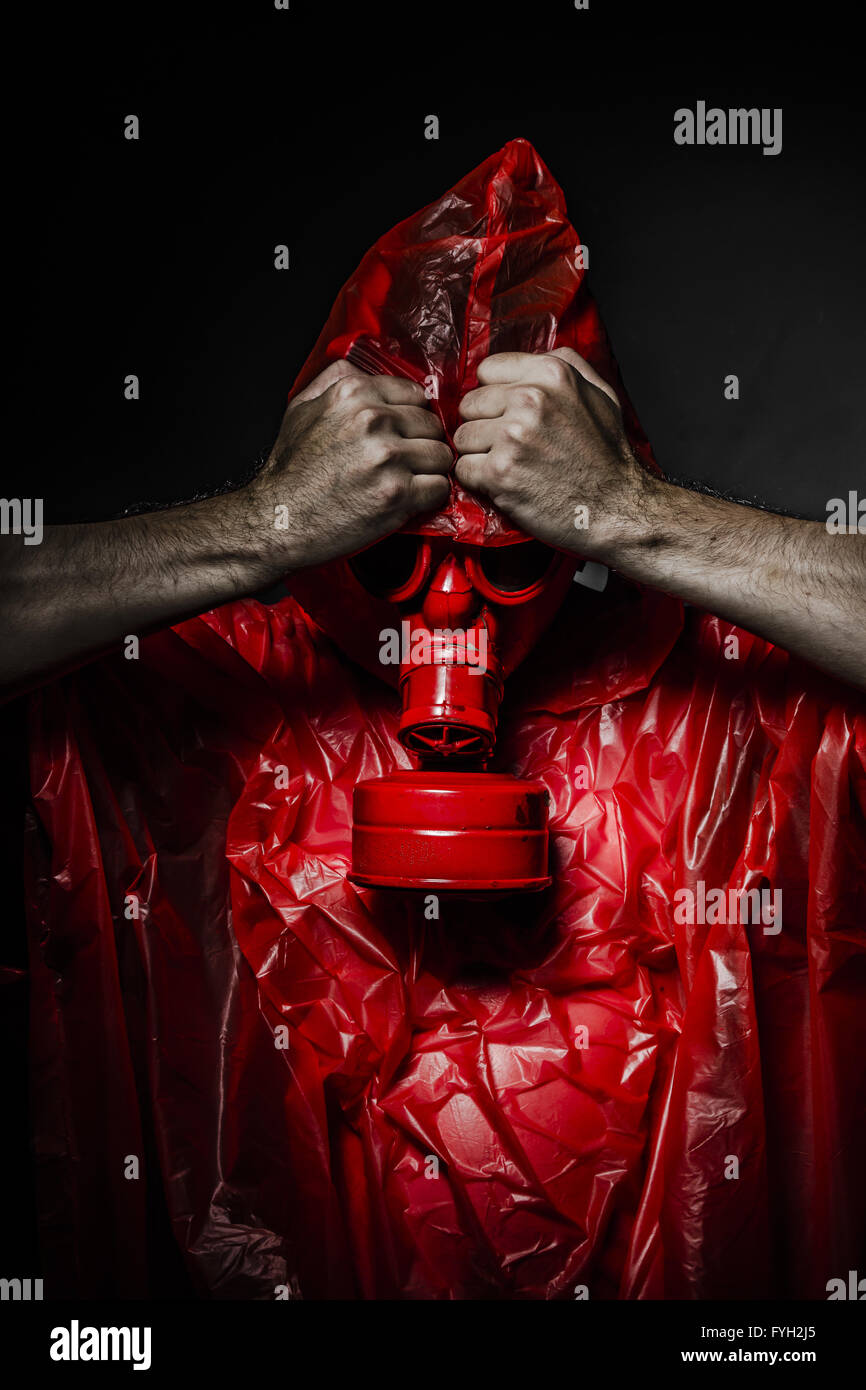 Toxic concept, man with red gas mask Stock Photo - Alamy