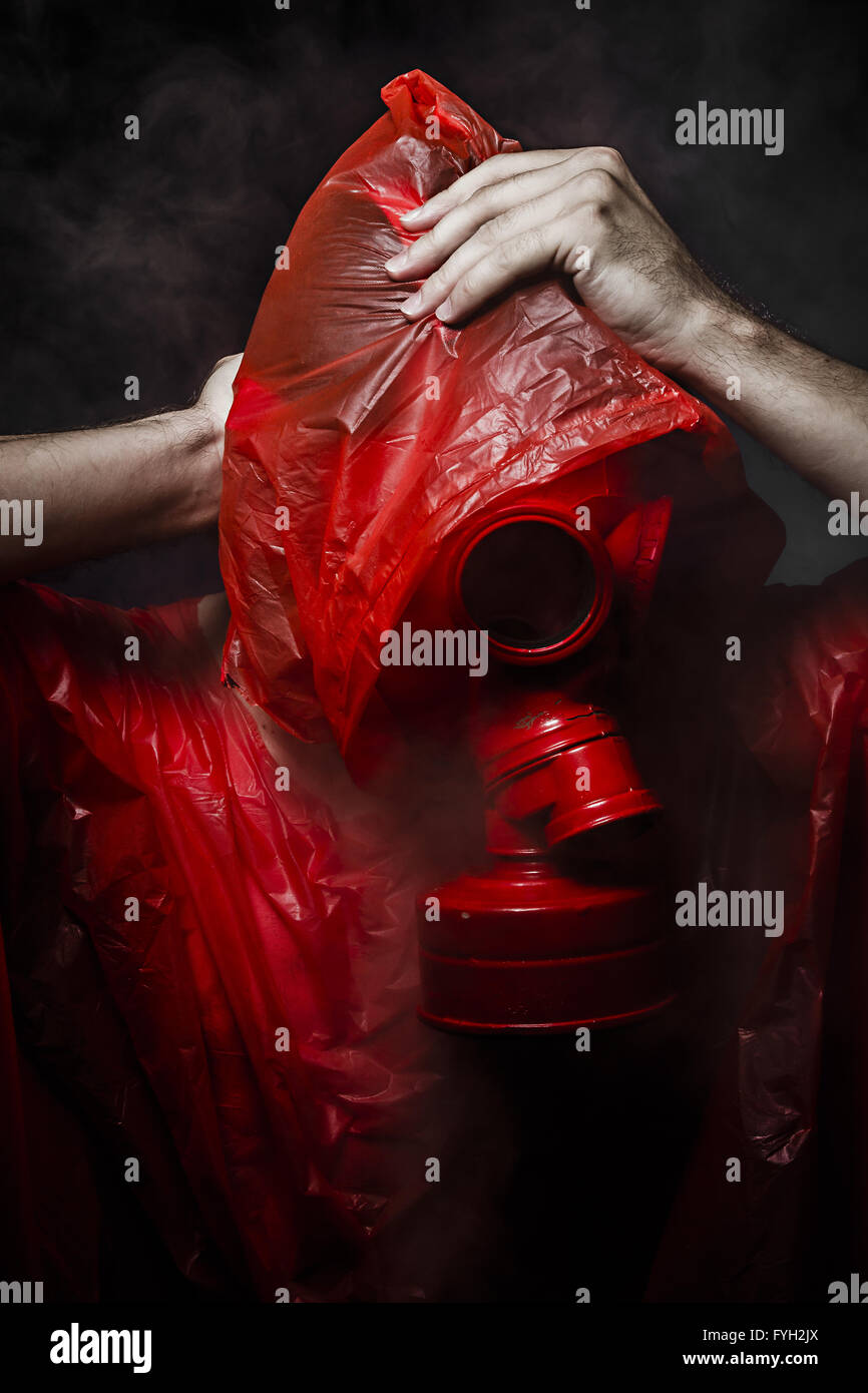 Toxic horror concept, man with red gas mask Stock Photo - Alamy