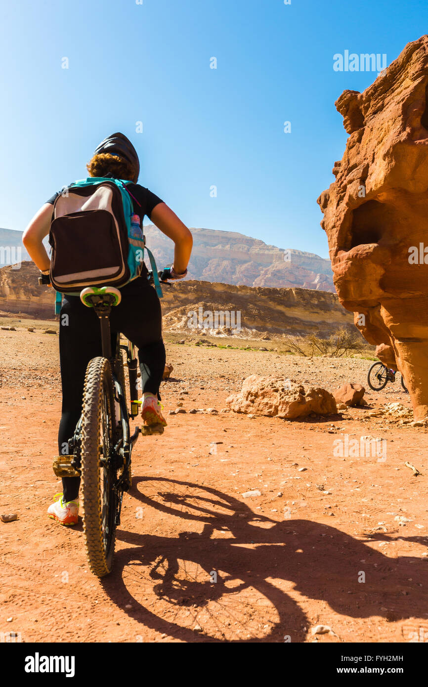 desert landscape, people riding bicycles along the canyon Stock Photo ...