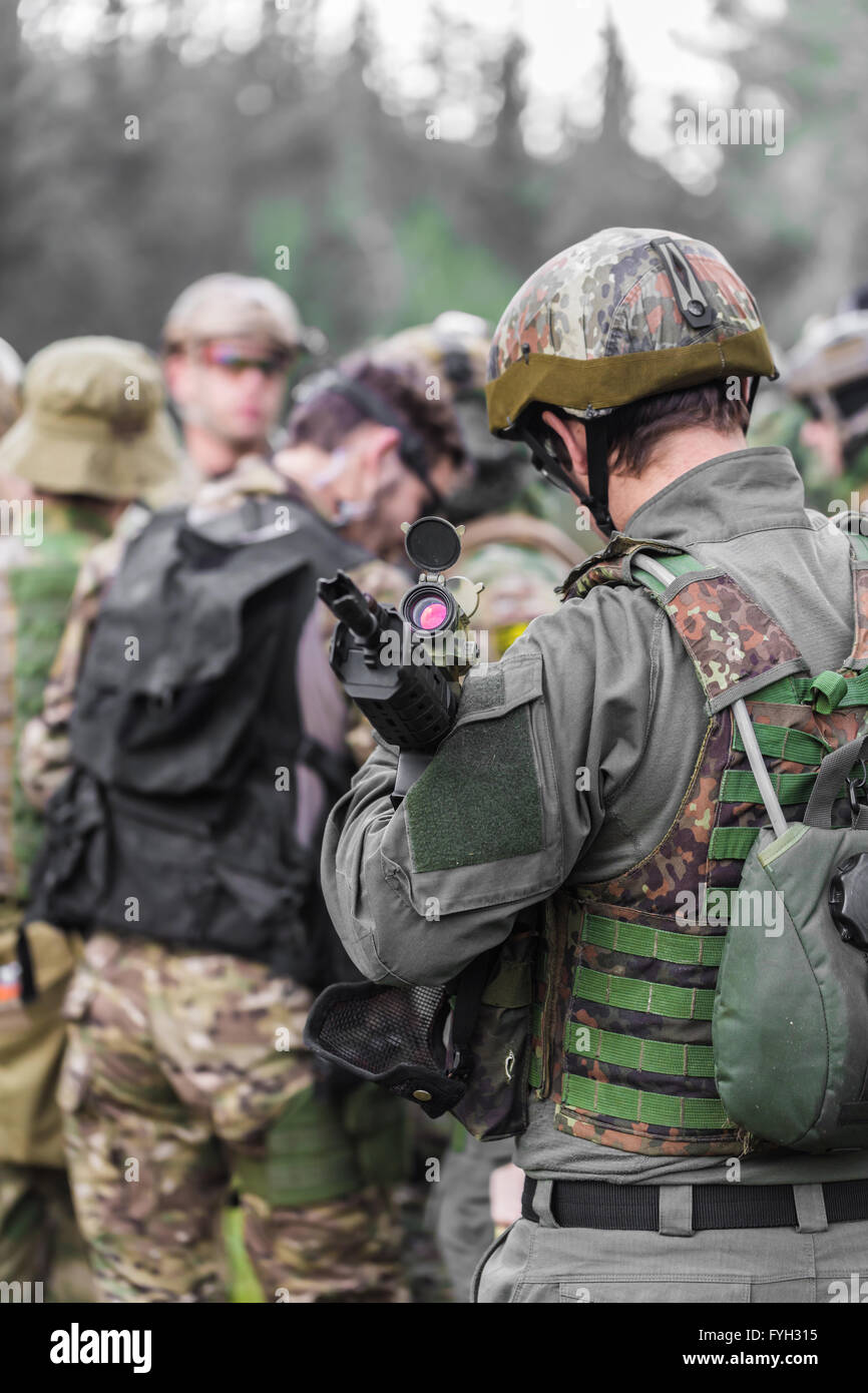 men in military uniform with weapon on a mission Stock Photo - Alamy