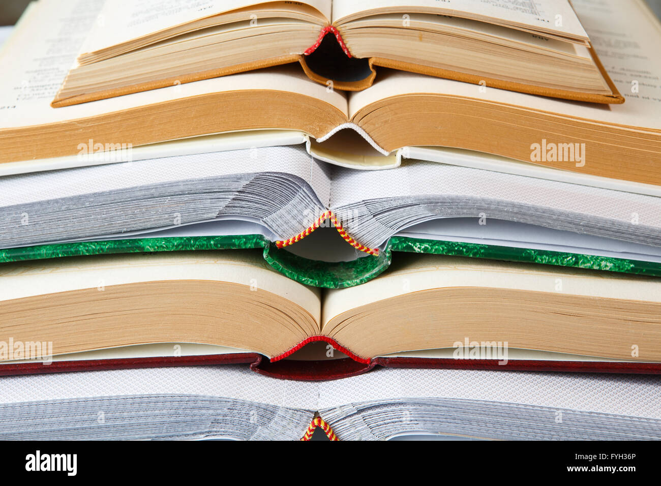 Pile of open books Stock Photo - Alamy