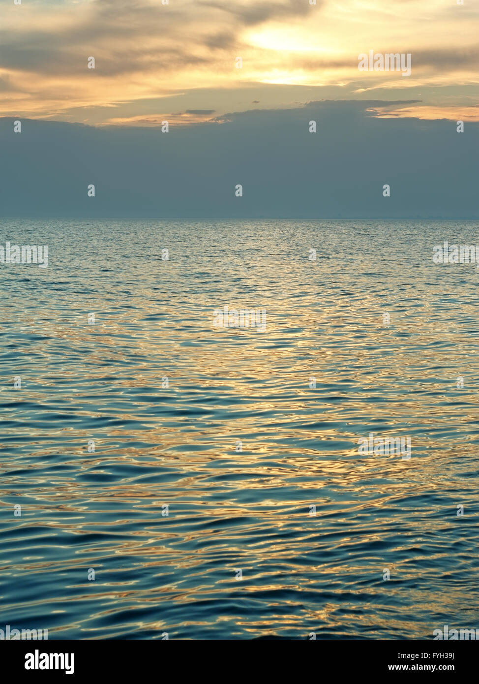 After sunset orange sky reflected in water hi-res stock photography and ...