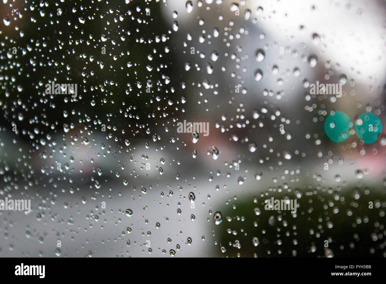 Raindrops on Window in the City Stock Photo - Alamy