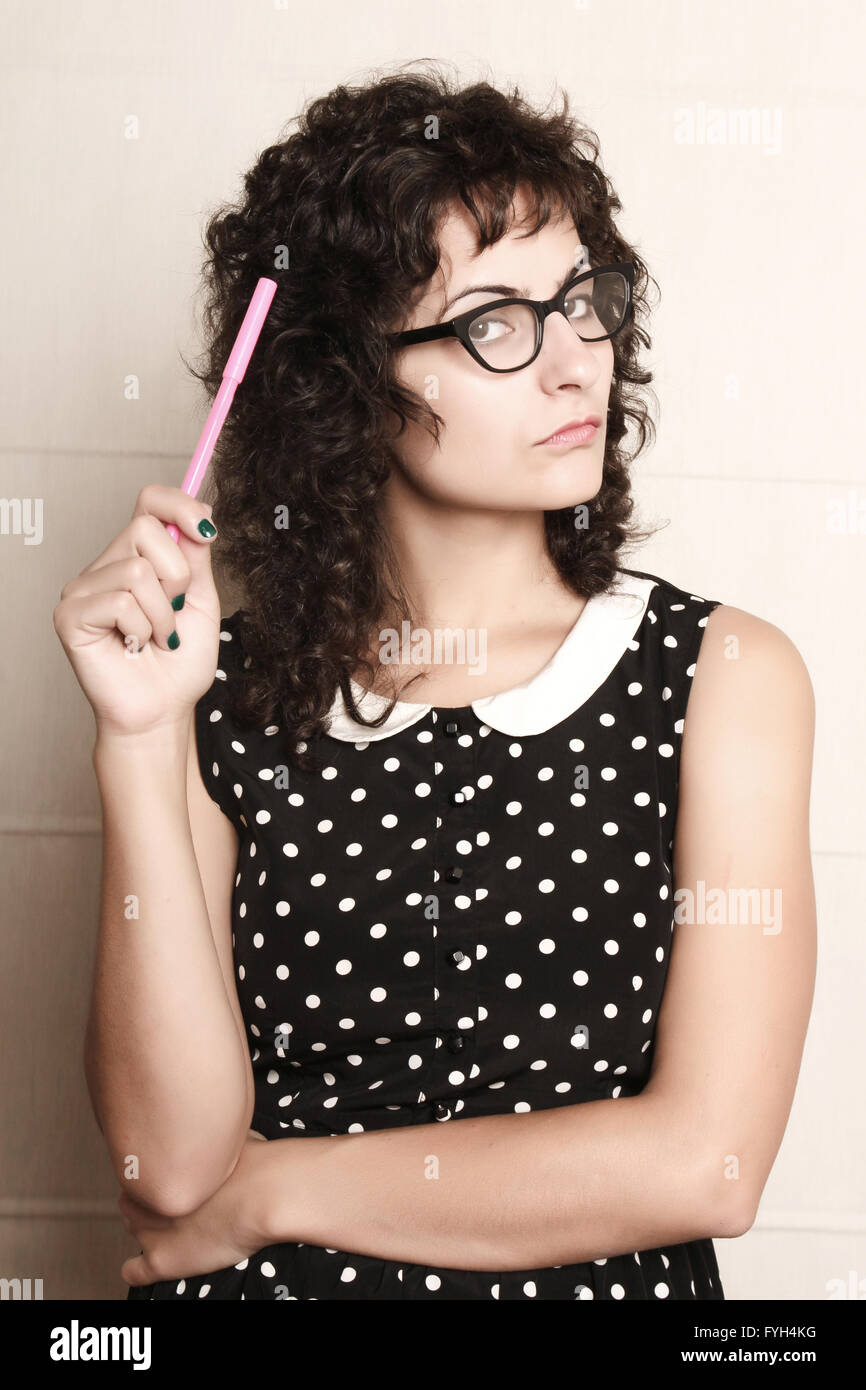 Pensive with a Pen Stock Photo - Alamy