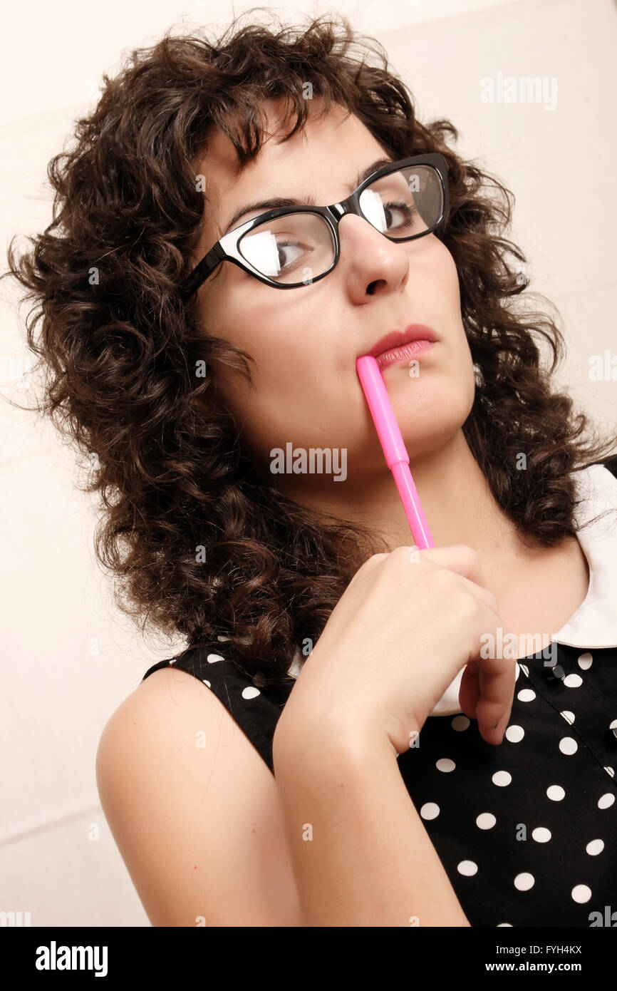 Pensive with a Pen Stock Photo - Alamy