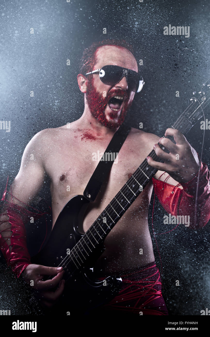 Rock star playing solo on guitar. man performing electrical music Stock ...