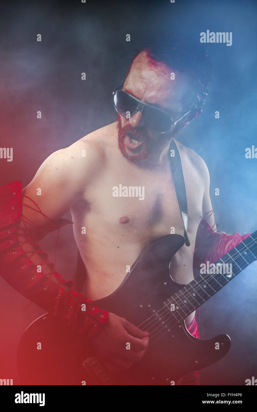 Rock star playing solo on guitar. passionate guitarist Stock Photo - Alamy