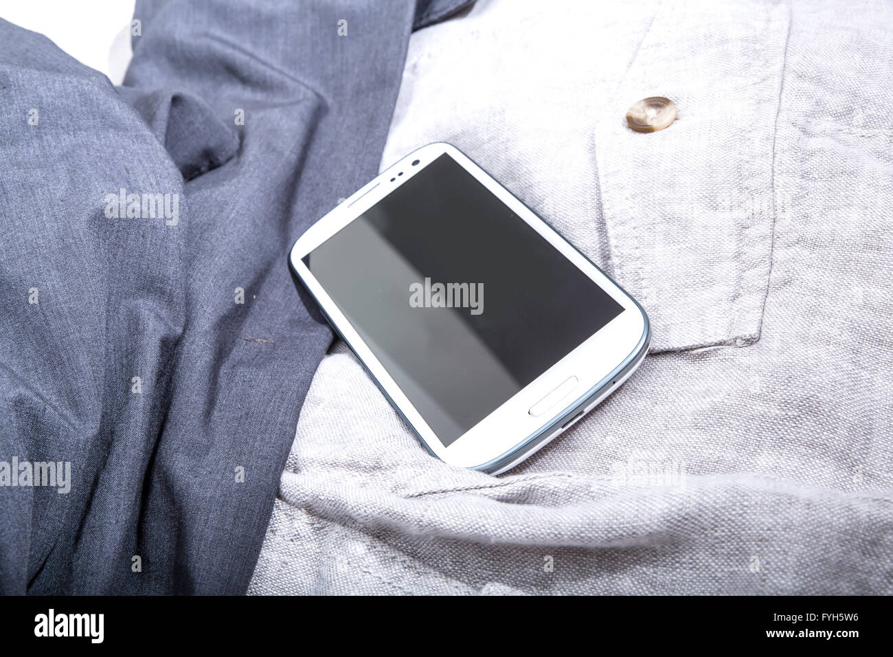 Smartphone on Cloth Stock Photo - Alamy
