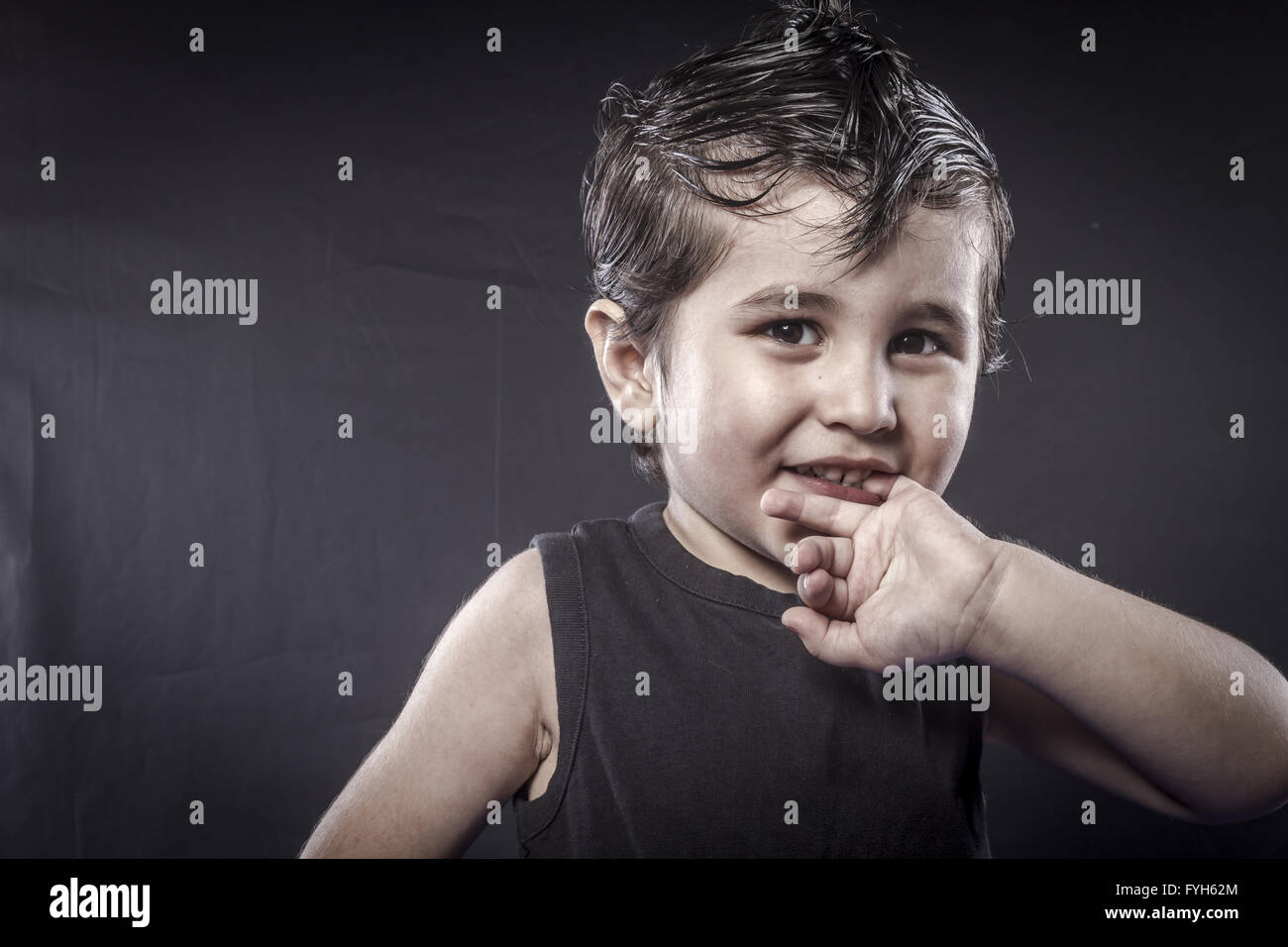 Rock, child rocker dress and funny expressions crested Stock Photo - Alamy