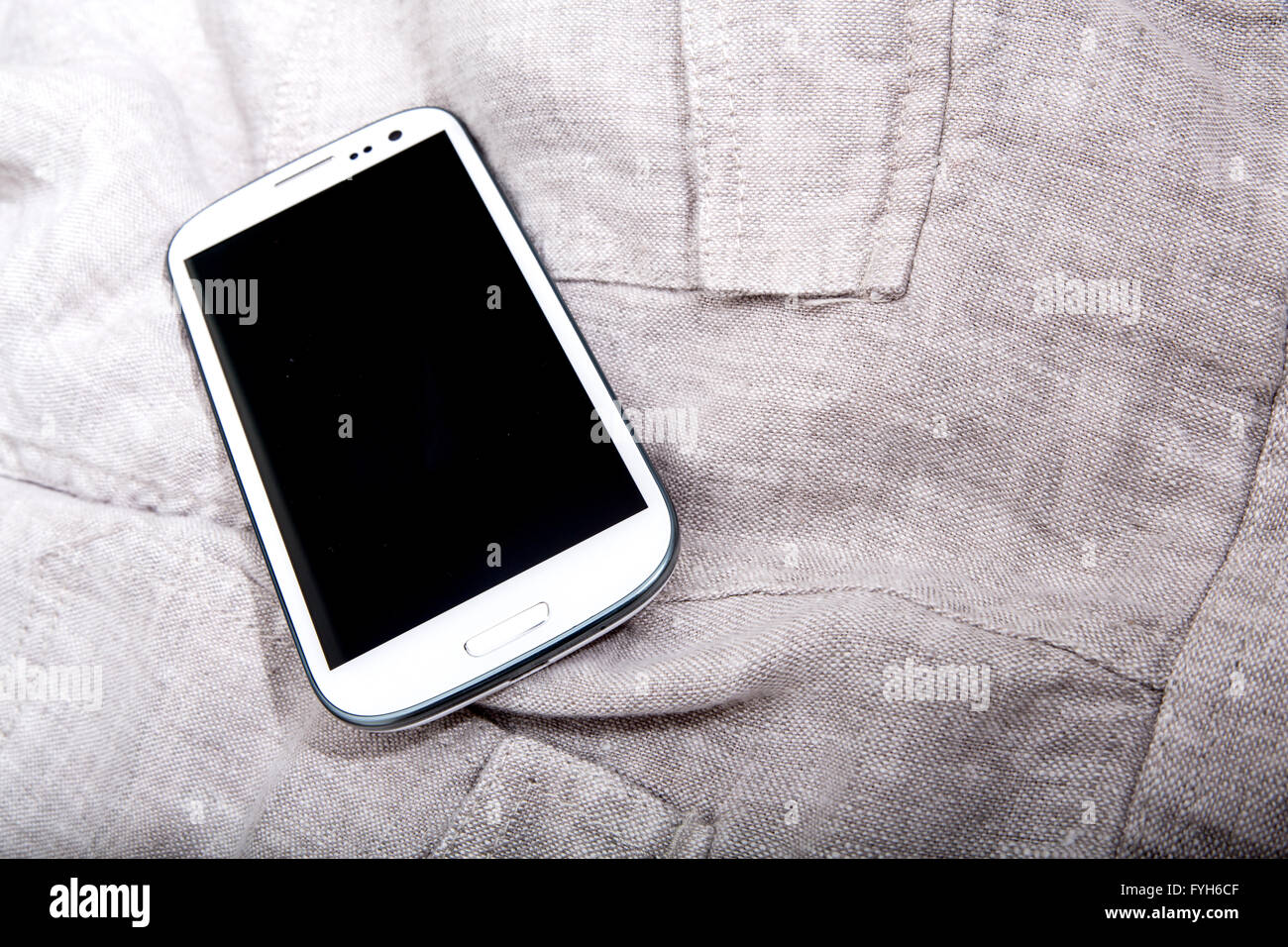 Smartphone on Cloth Stock Photo - Alamy