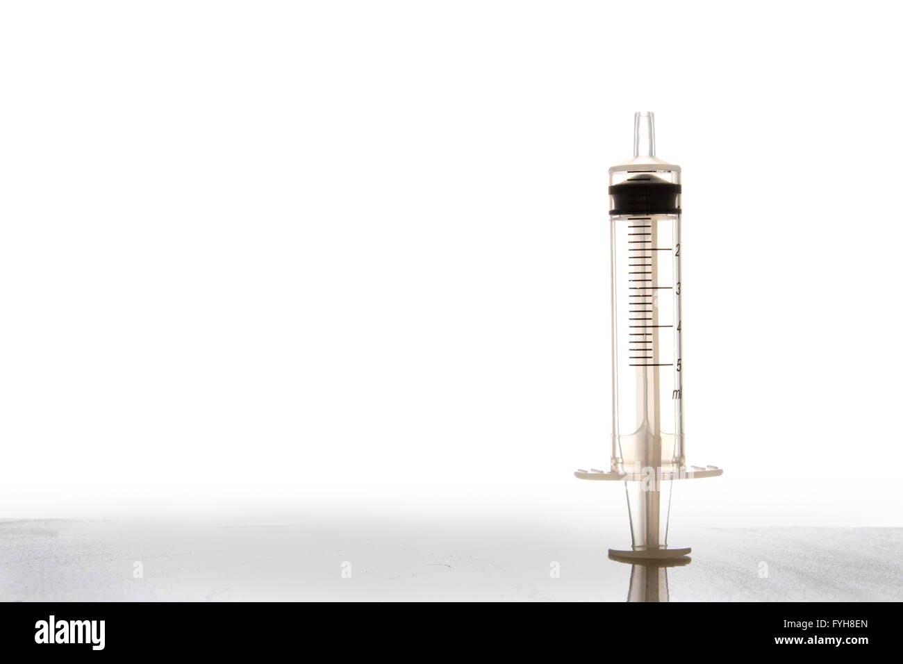 A back lit empty syringe Stock Photo - Alamy