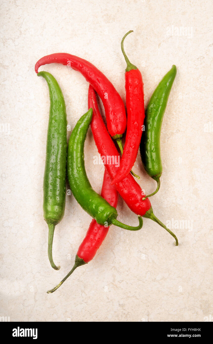 fresh wet green and red hot and spicy chili pepper Stock Photo - Alamy