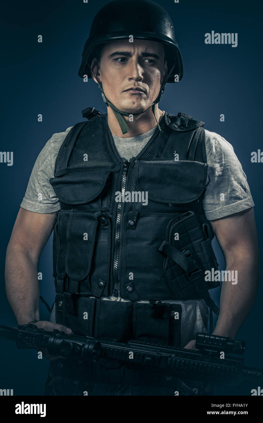 Security concept, armed man with machine gun Stock Photo - Alamy