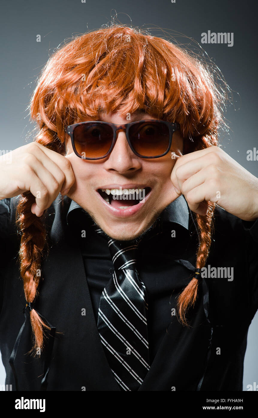 Funny man with red hair wig Stock Photo - Alamy
