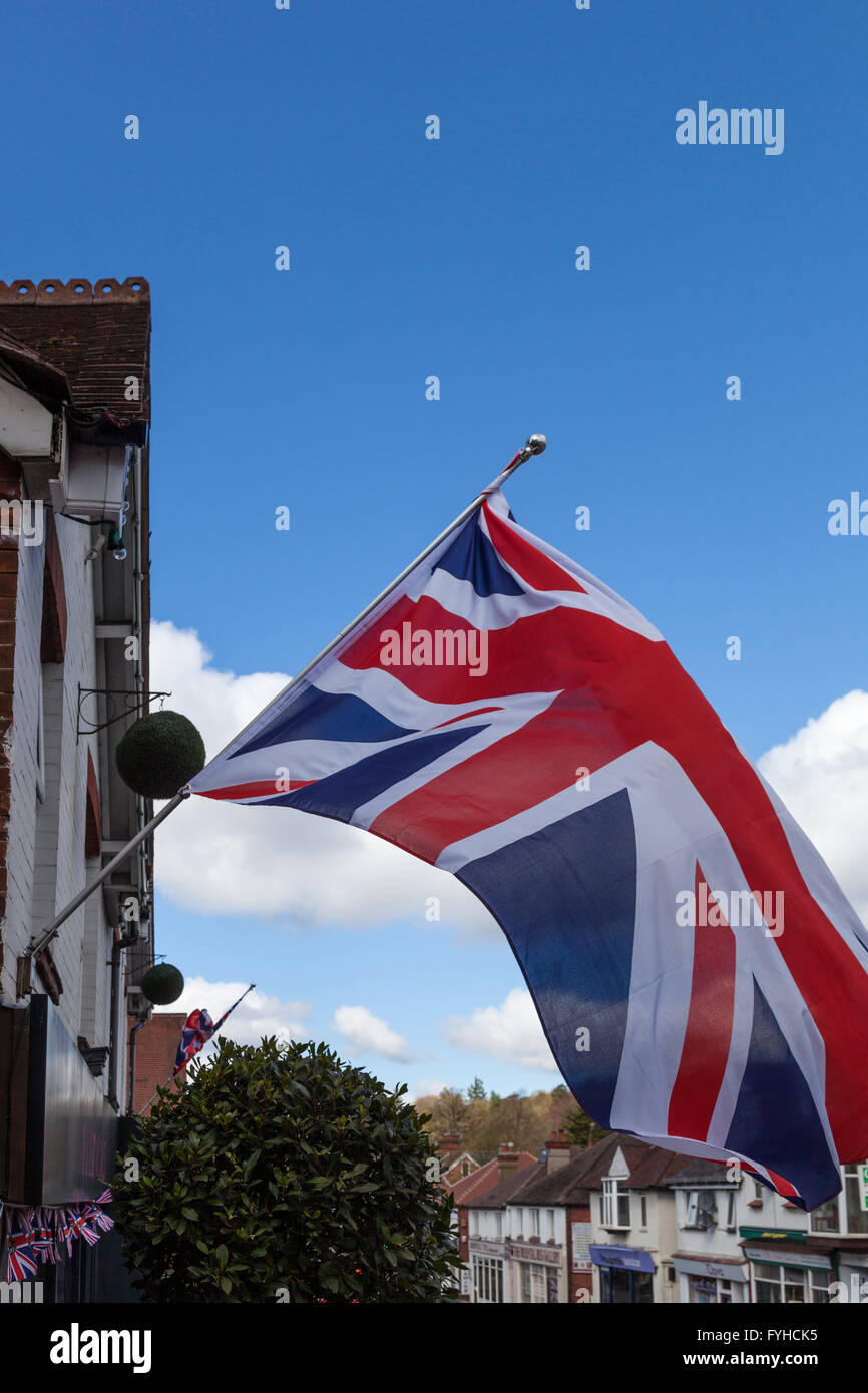 Union flags flying from a shop front in honour of the Queen's 90th ...