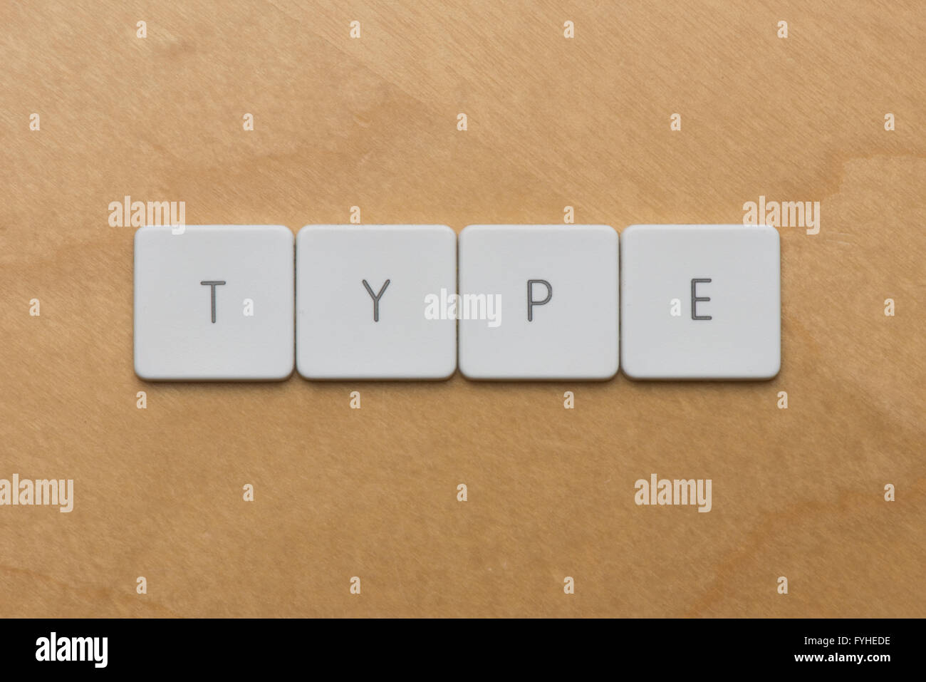 Keyboard letters spell type on wooden desktop background Stock Photo ...