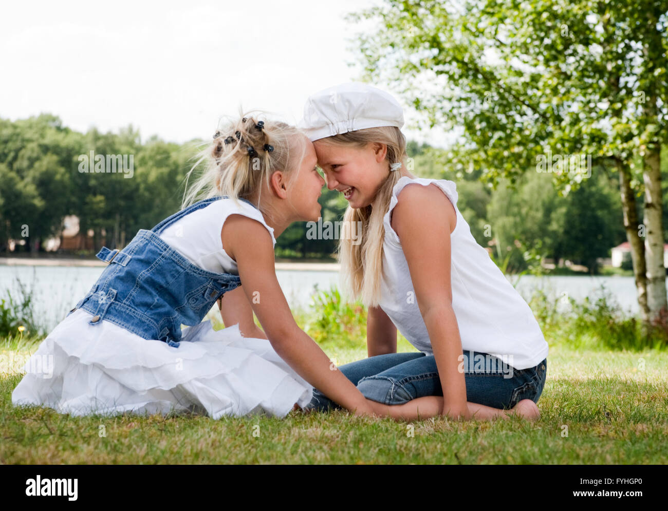 Head hugs in the grass Stock Photo - Alamy