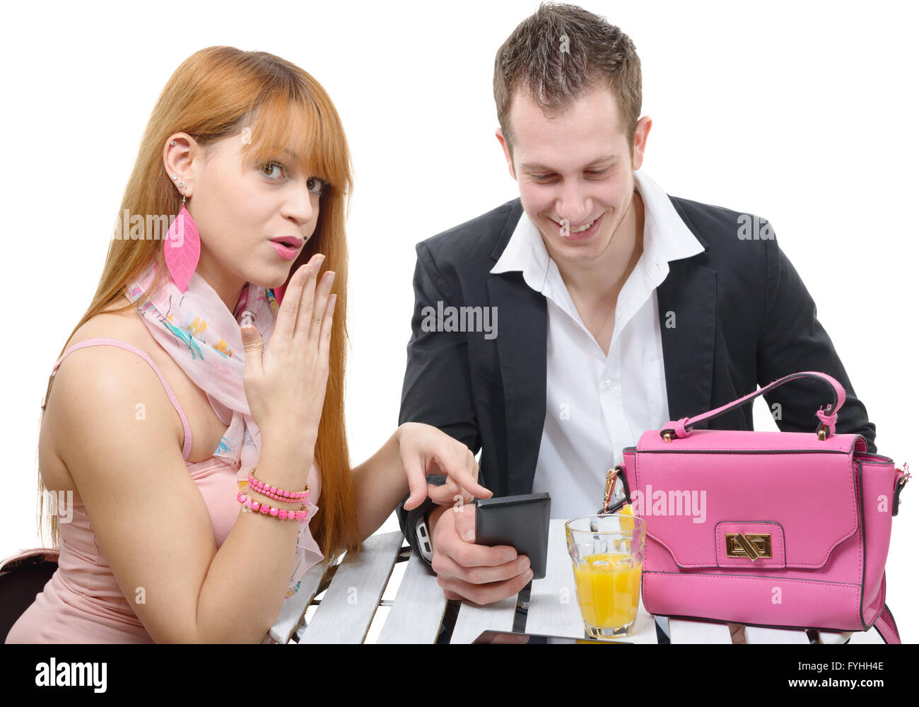 a happy couple with phones isolated on white background Stock Photo - Alamy