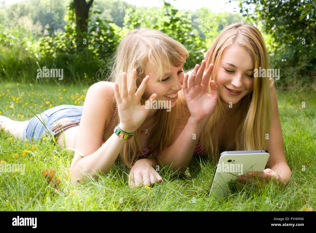 Cute friendly girls waving hi-res stock photography and images - Alamy