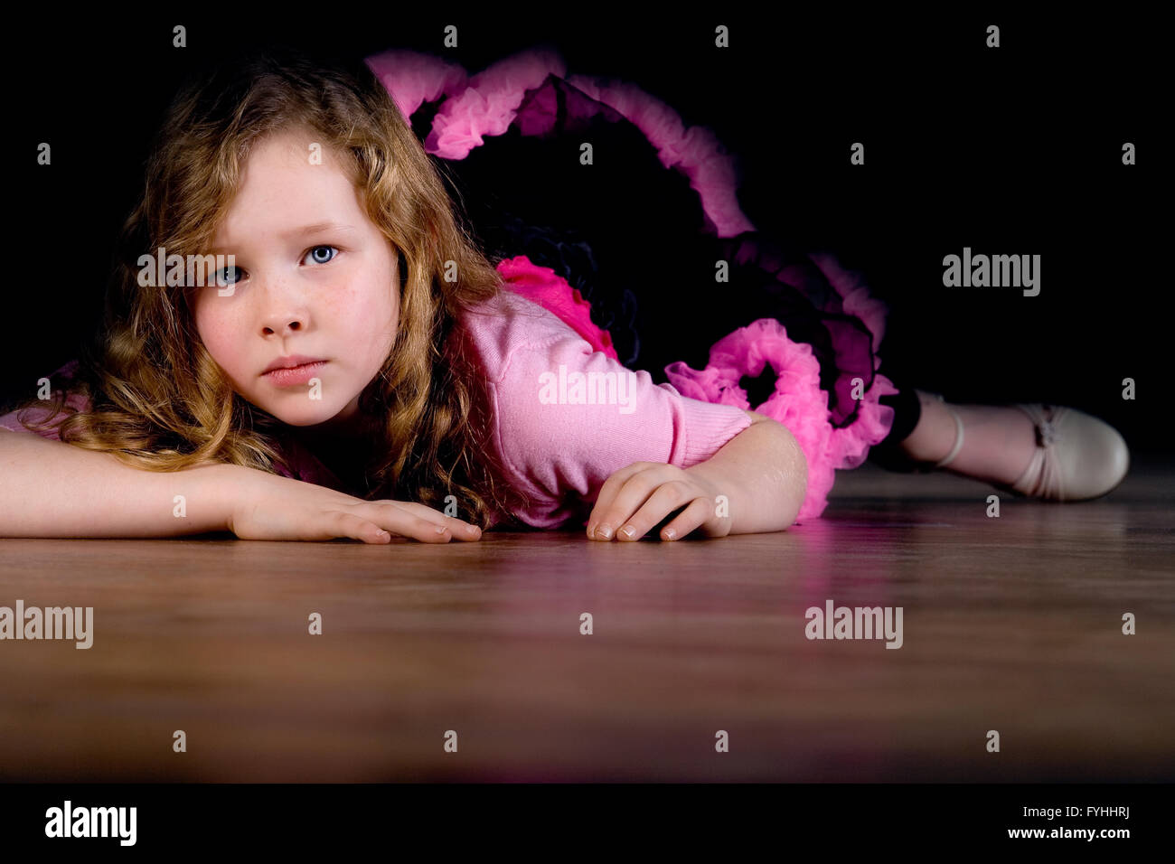 Ballet girl is laying down Stock Photo - Alamy