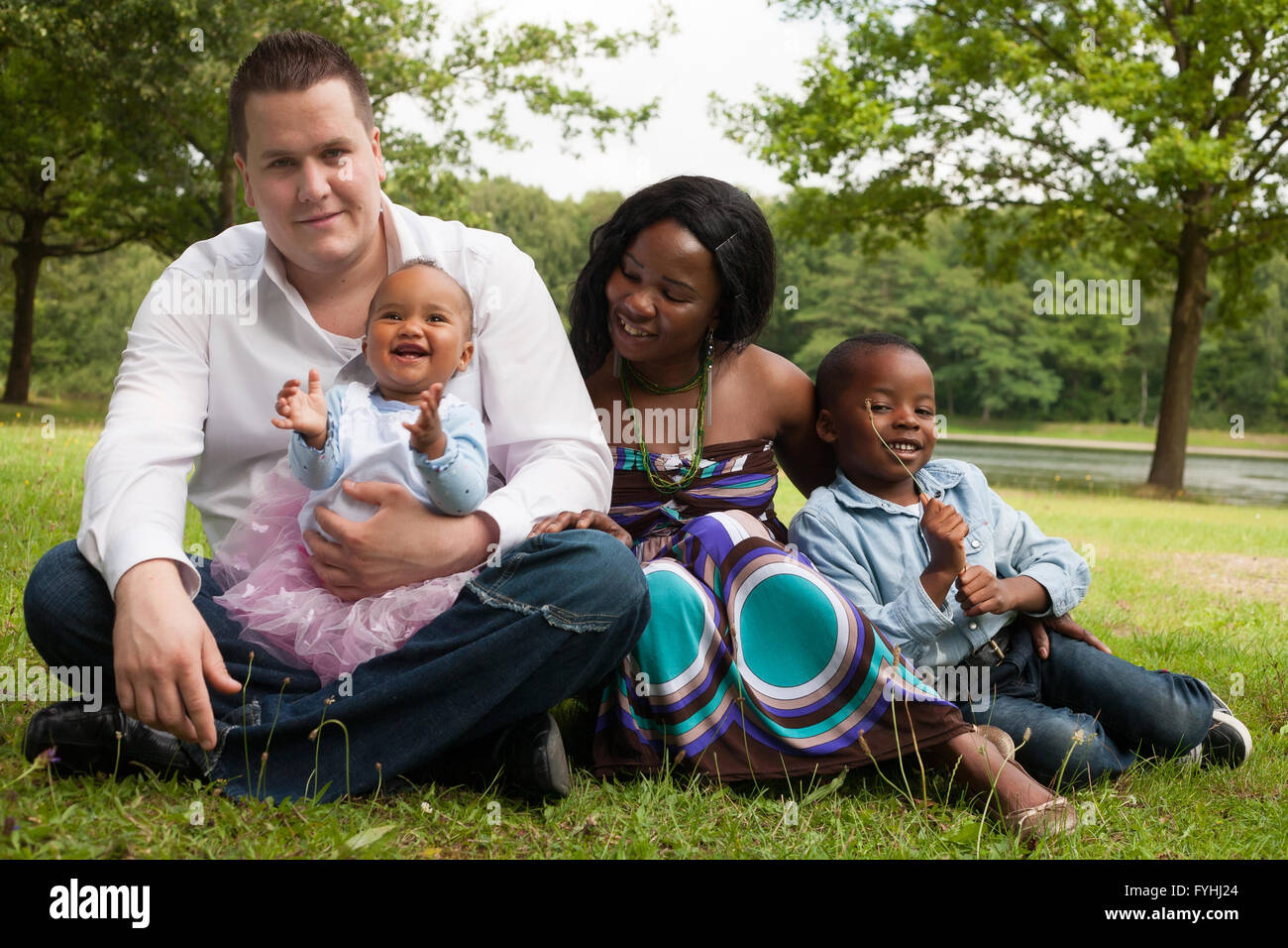 Mixed family and happy daughter Stock Photo - Alamy