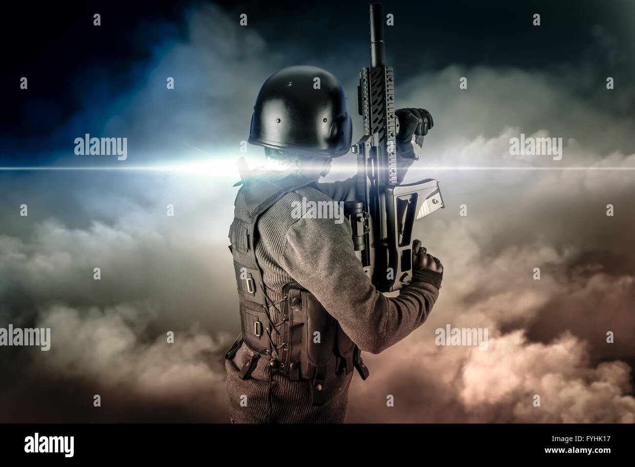 Soldier in uniform with rifle, assault sniper on apocalyptic clouds ...