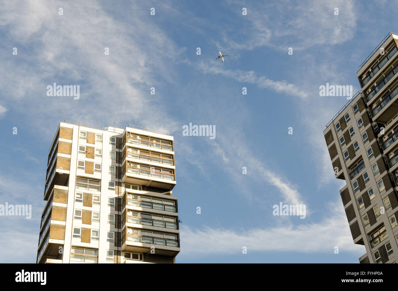 A flight passing over council estate tower blocks in Battersea, West ...
