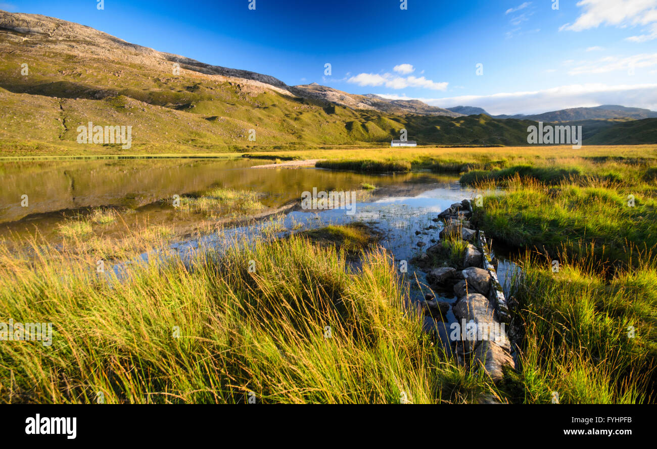 A small lake, Lochan an Iasgair, in the boggy valley floor of Glen ...
