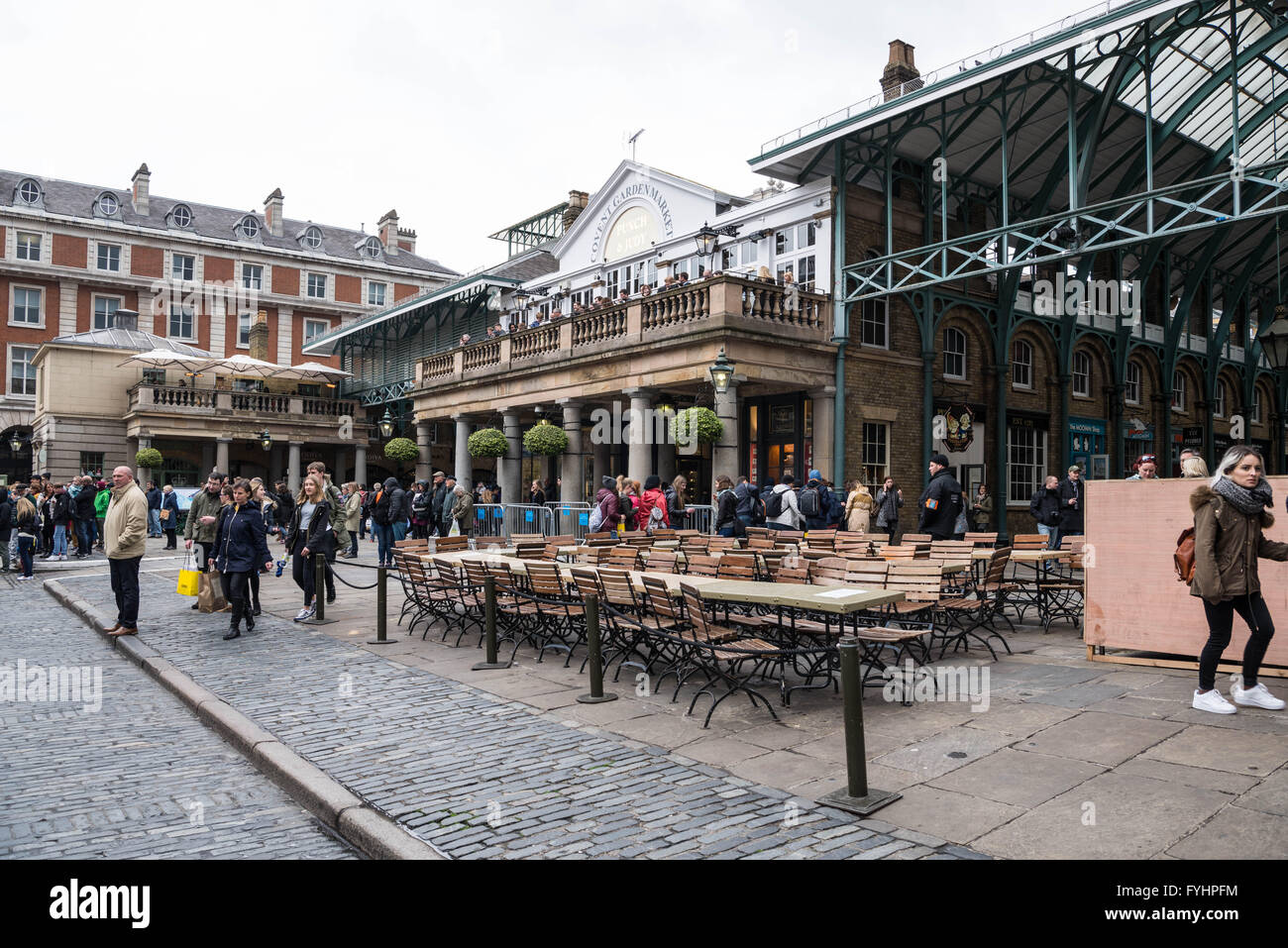 Old Covent Garden, London. People in the area of the piazza between the ...