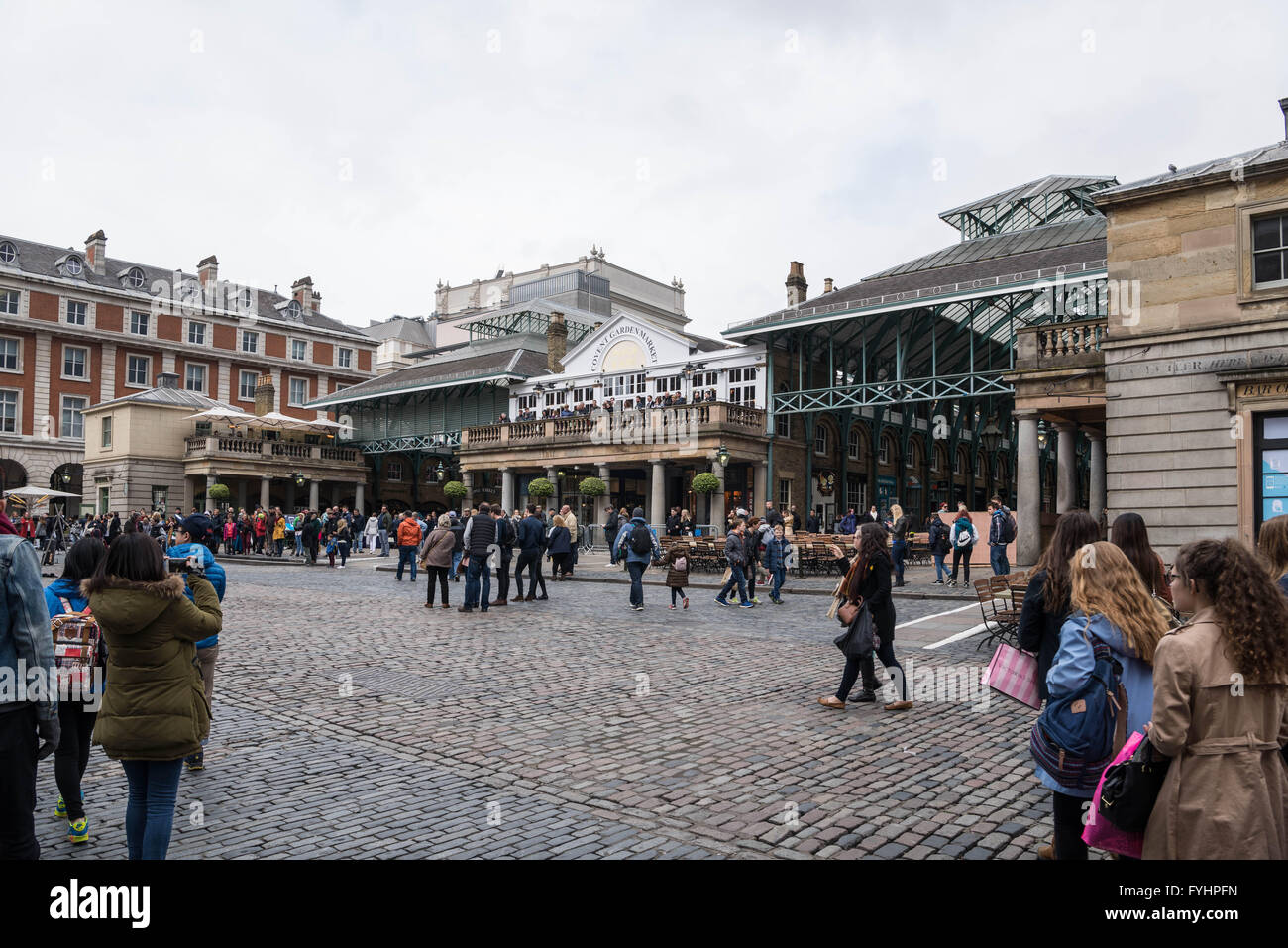 Old Covent Garden, London. People walking in the piazza between the old ...