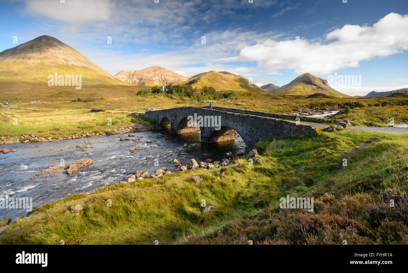 Old stone arch bridge over a mountain river at Sligachan on the Isle of ...