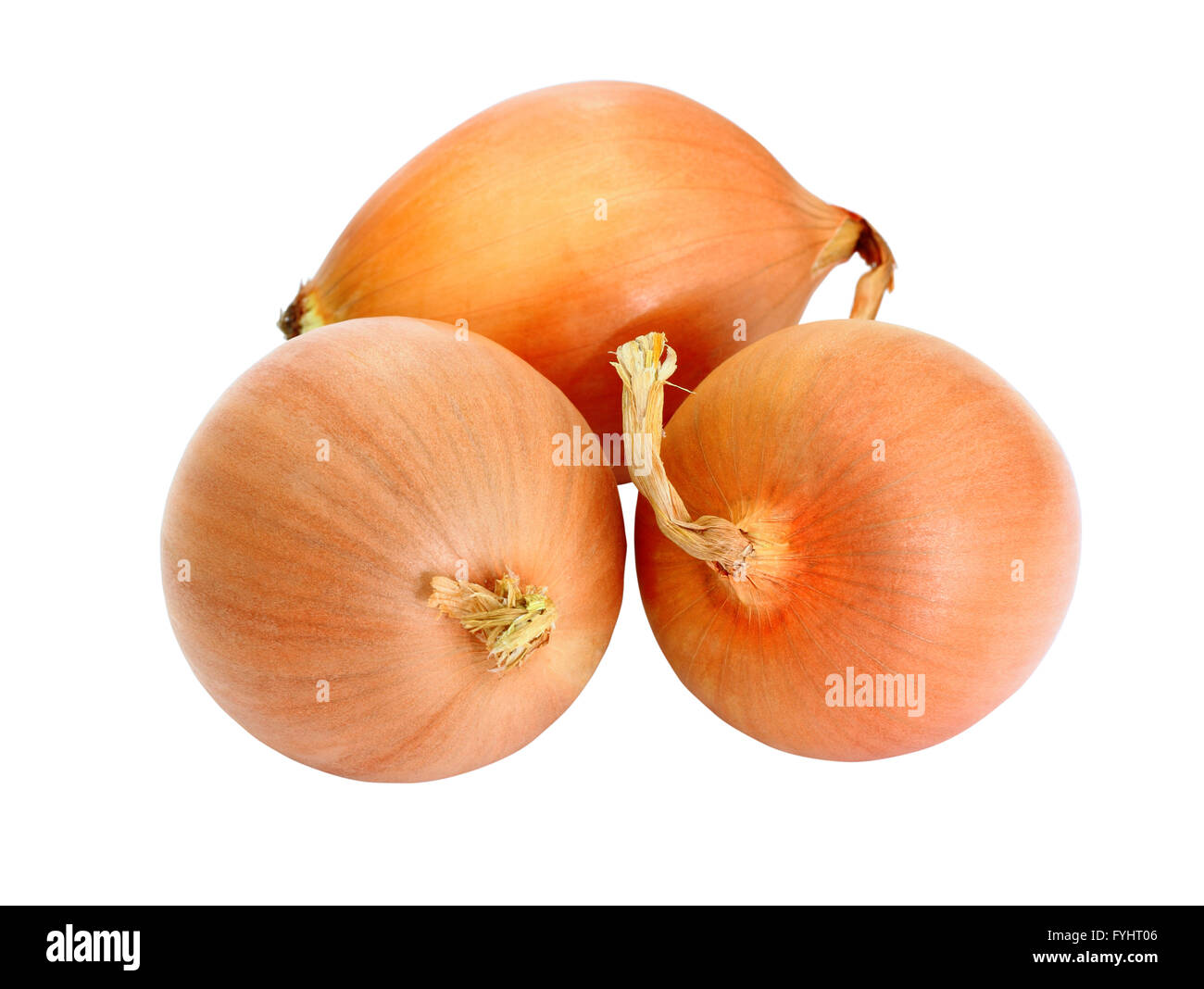 three golden onions, isolated on white background Stock Photo - Alamy