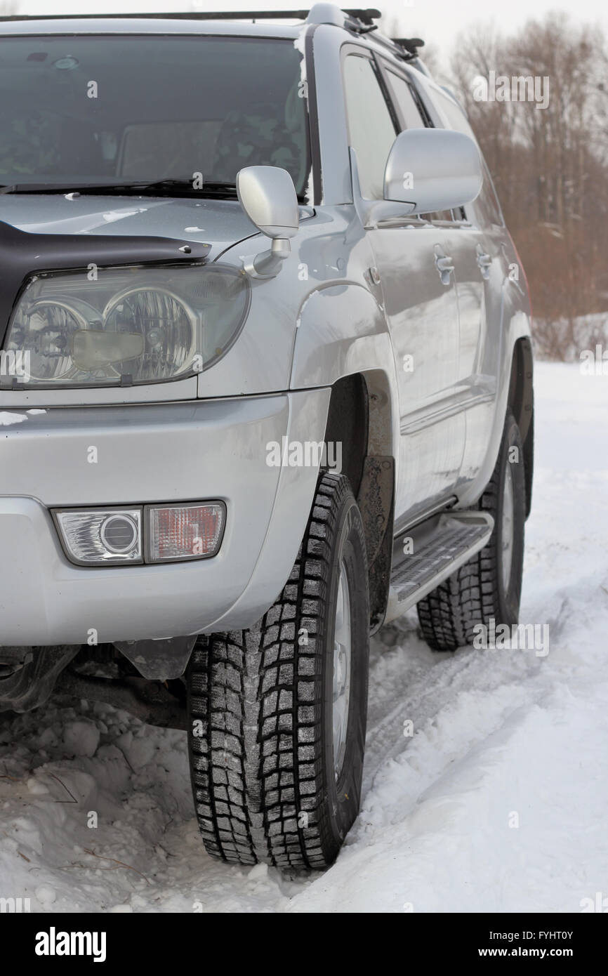 Snowy winter road ahead an unrecognizable car Stock Photo - Alamy