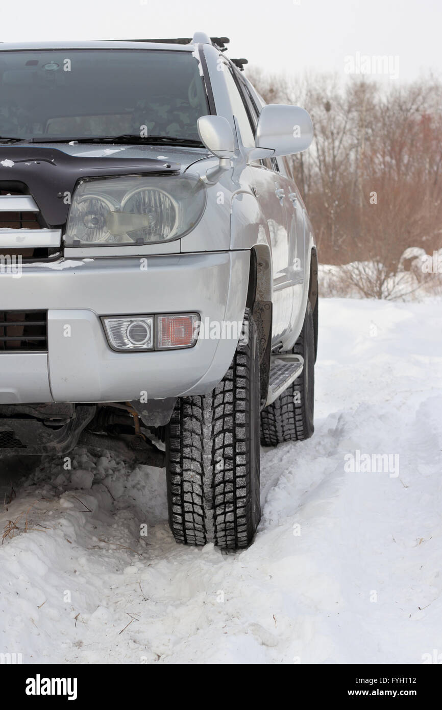 Snowy winter road ahead an unrecognizable car Stock Photo - Alamy