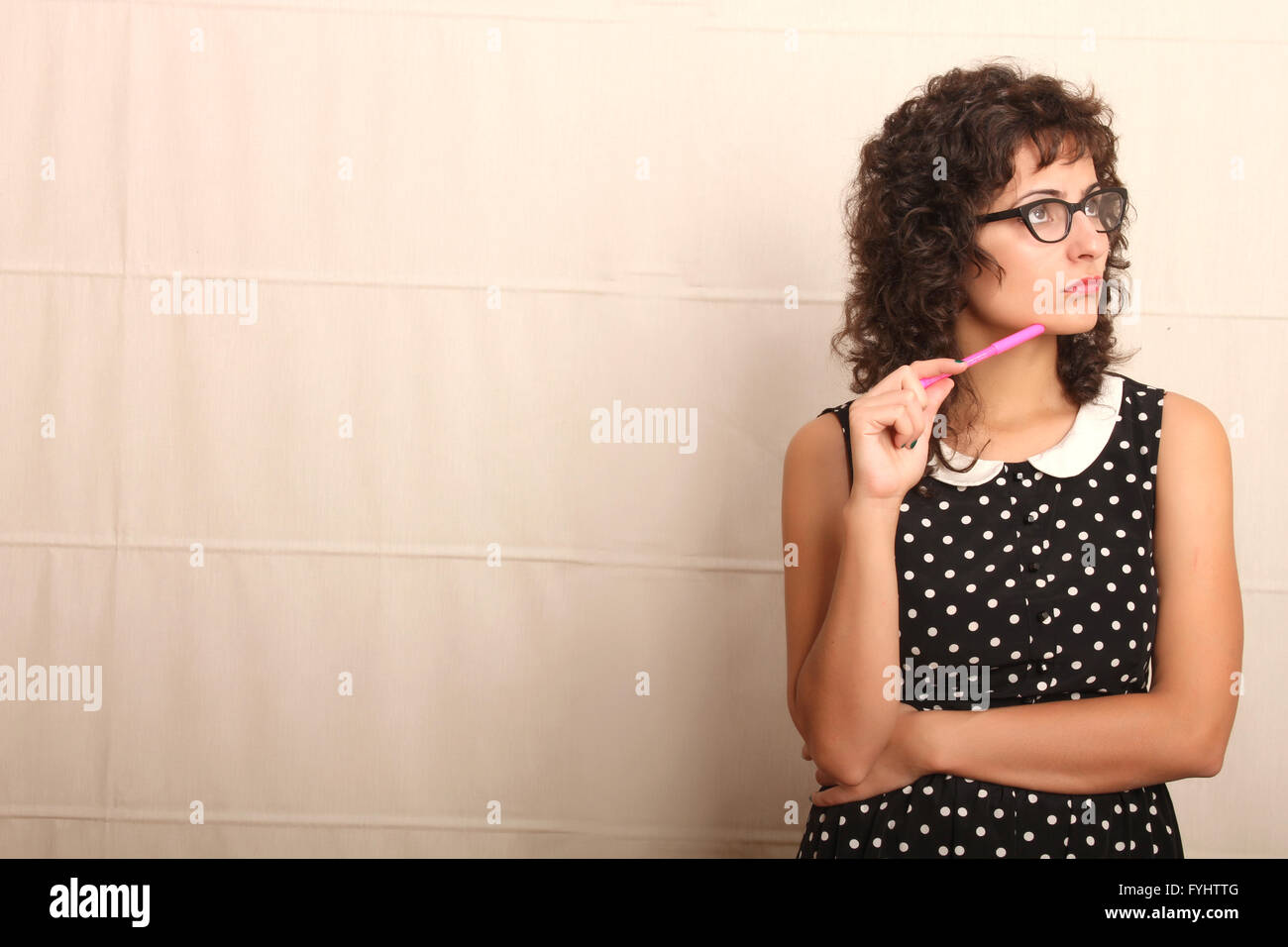 Pensive with a Pen Stock Photo - Alamy