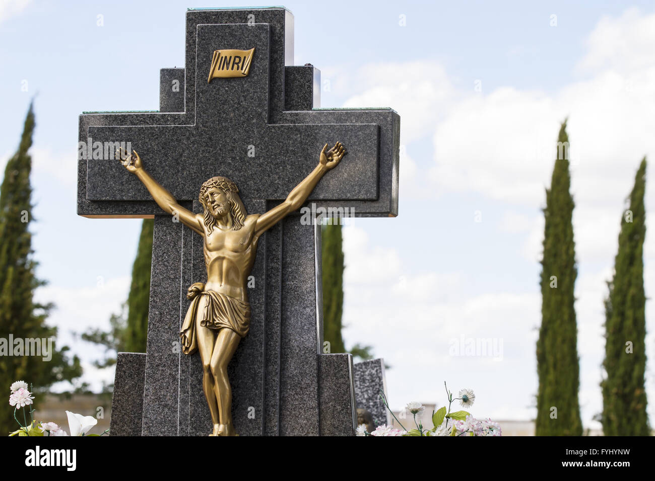 Jesus Christ on the cross in a cemetery Stock Photo - Alamy