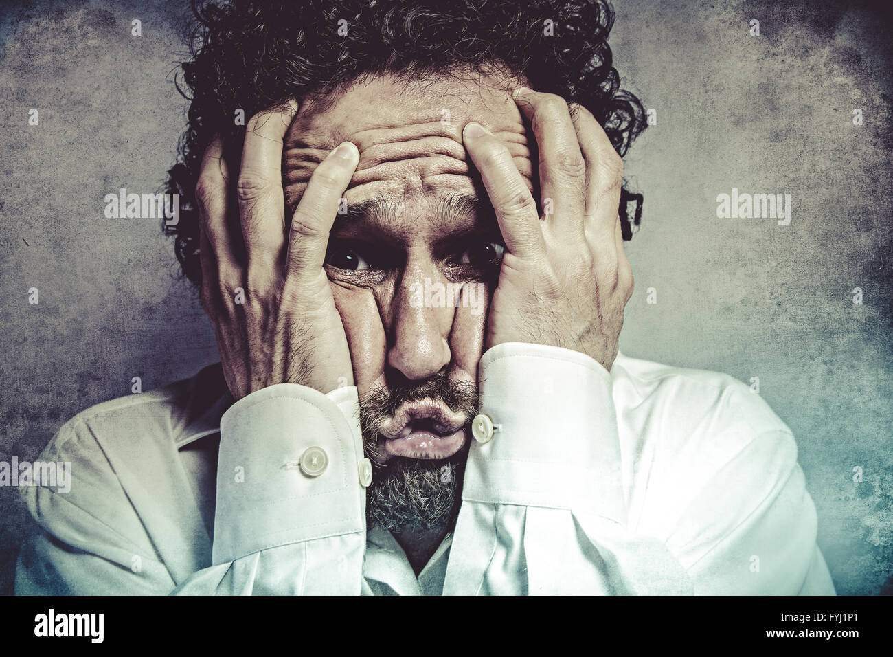 Fear, man in white shirt with funny expressions Stock Photo - Alamy