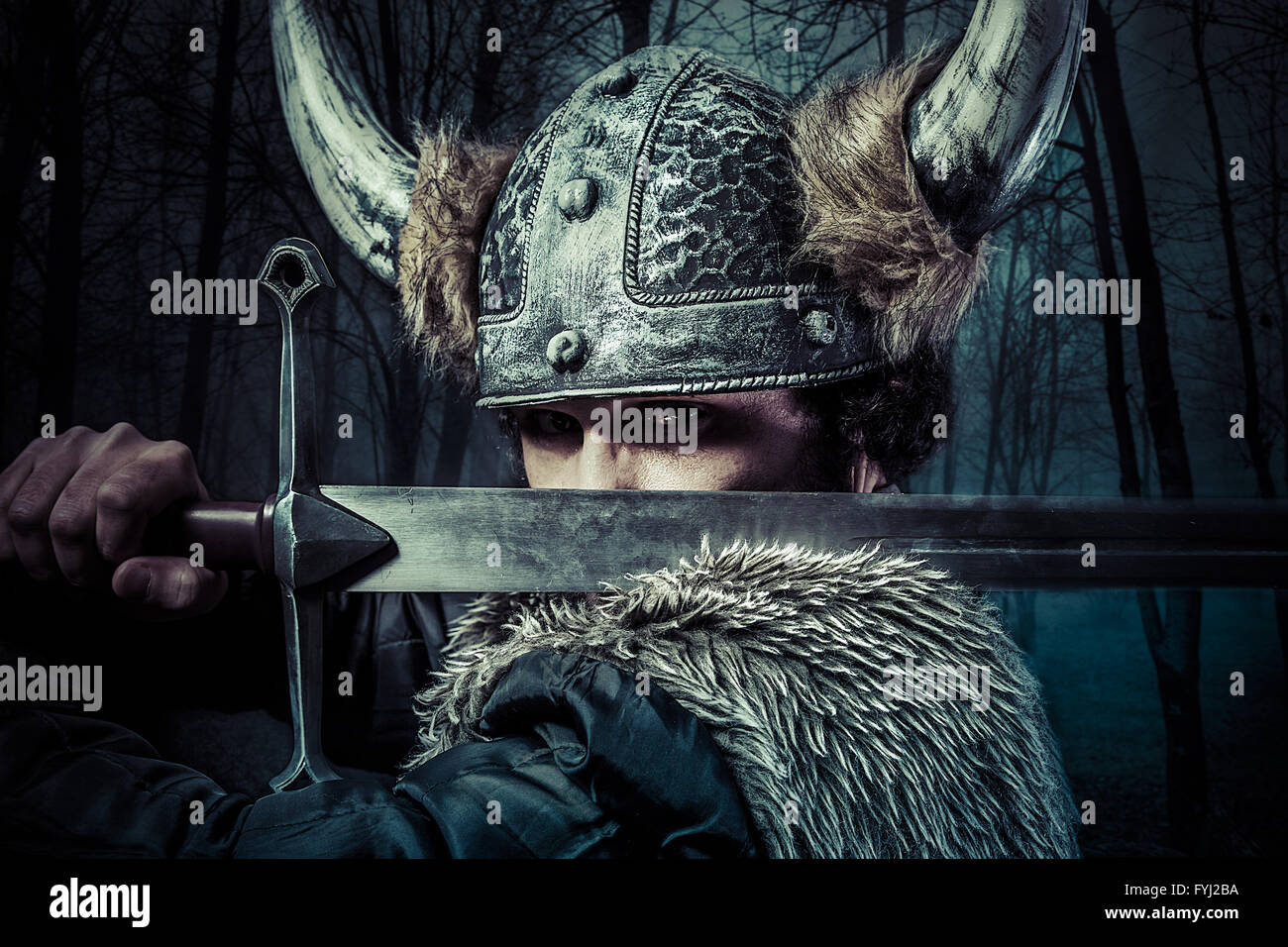 Defense, Viking warrior, male dressed in Barbarian style with sword ...