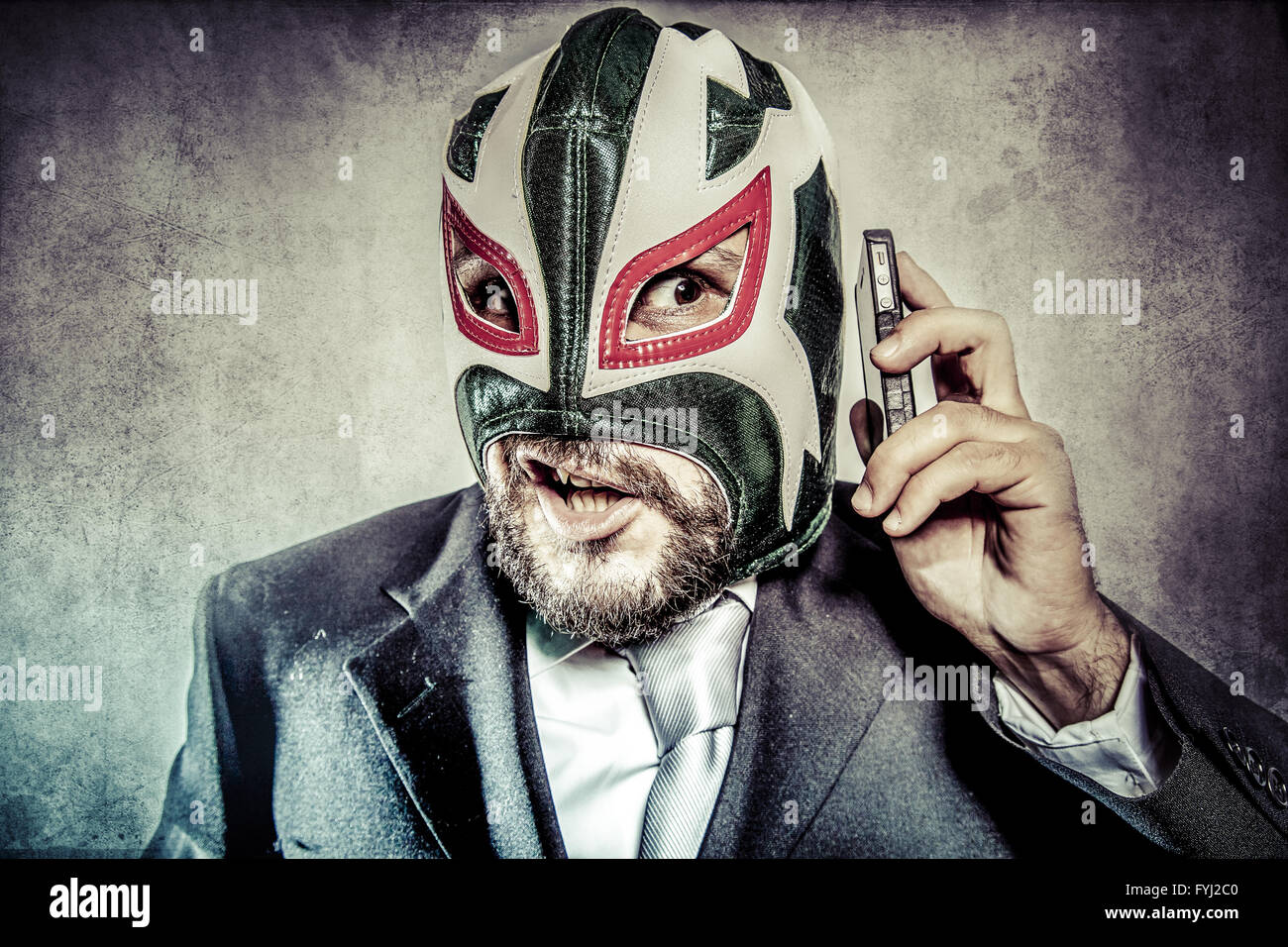 Trouble, aggressive executive suit and tie, Mexican wrestler mask Stock ...